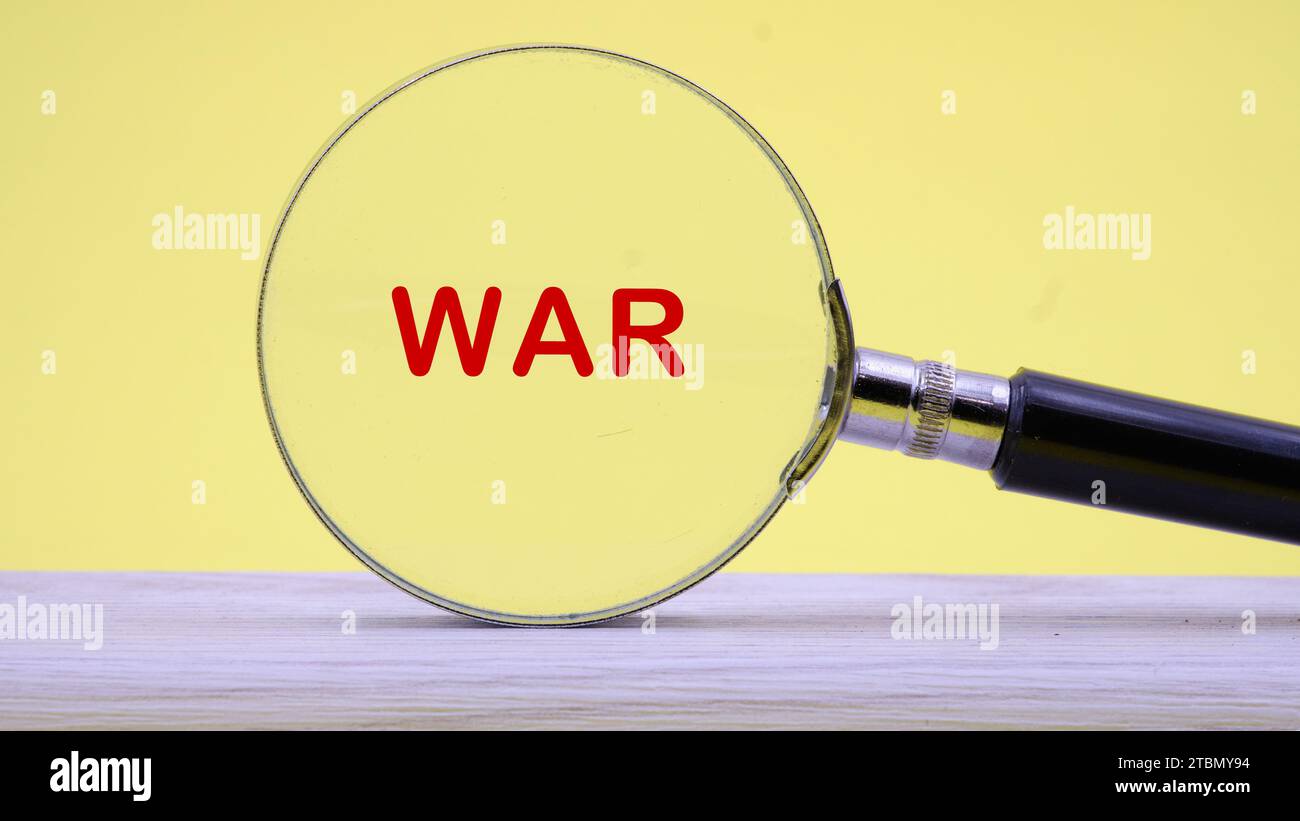 A word war lettering on through a magnifying glass on a light ...
