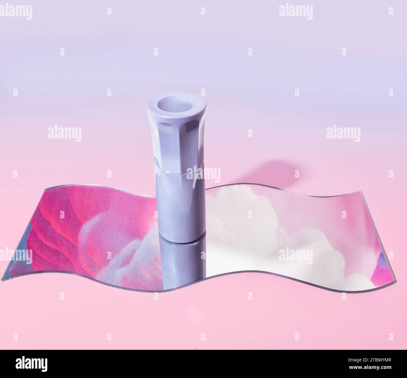 A Single Tube of Purple Makeup Packaging on a Mirror in a Pastel Beauty ...