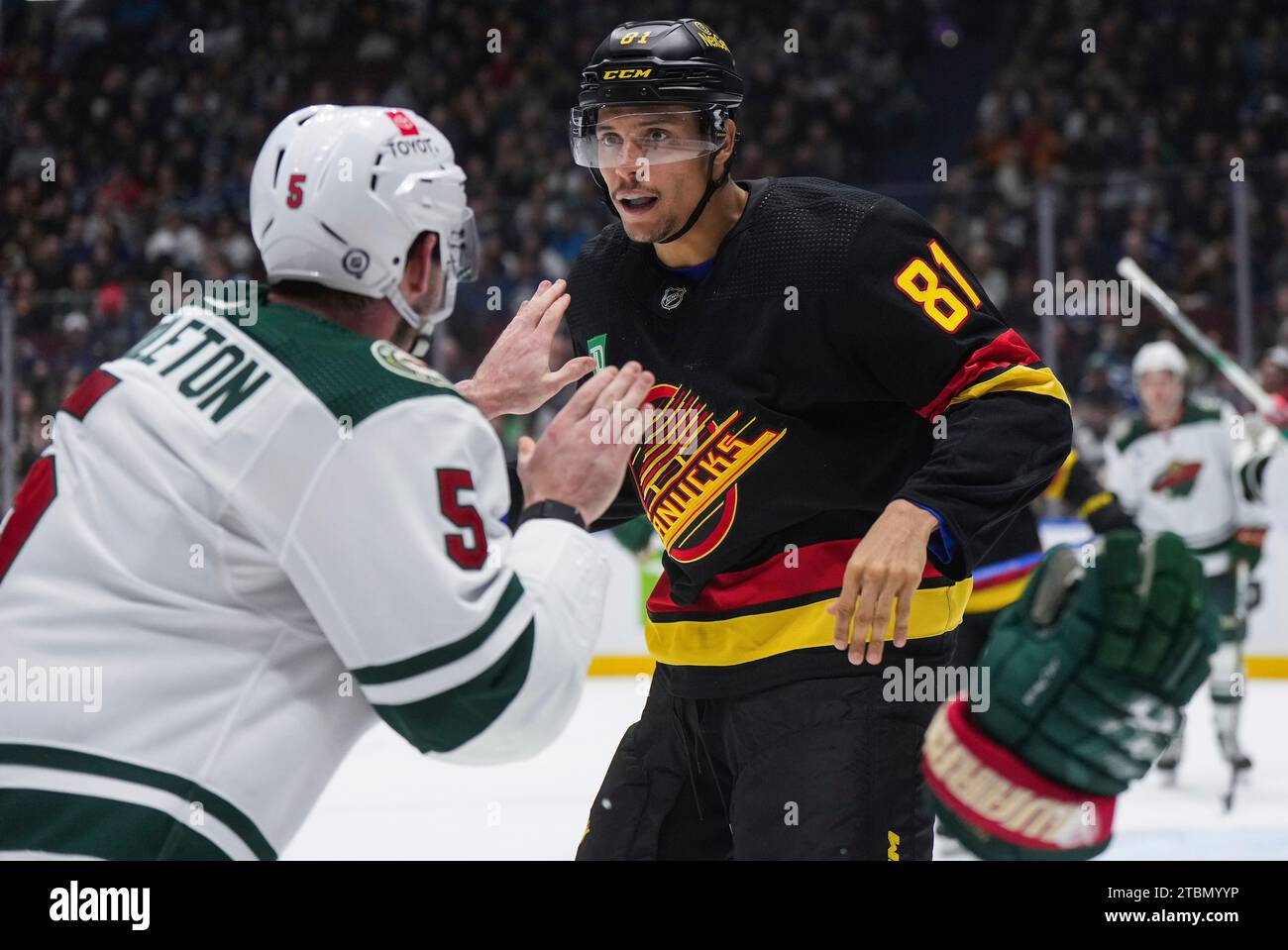 Vancouver Canucks' Dakota Joshua, right, and Minnesota Wild's Jacob ...