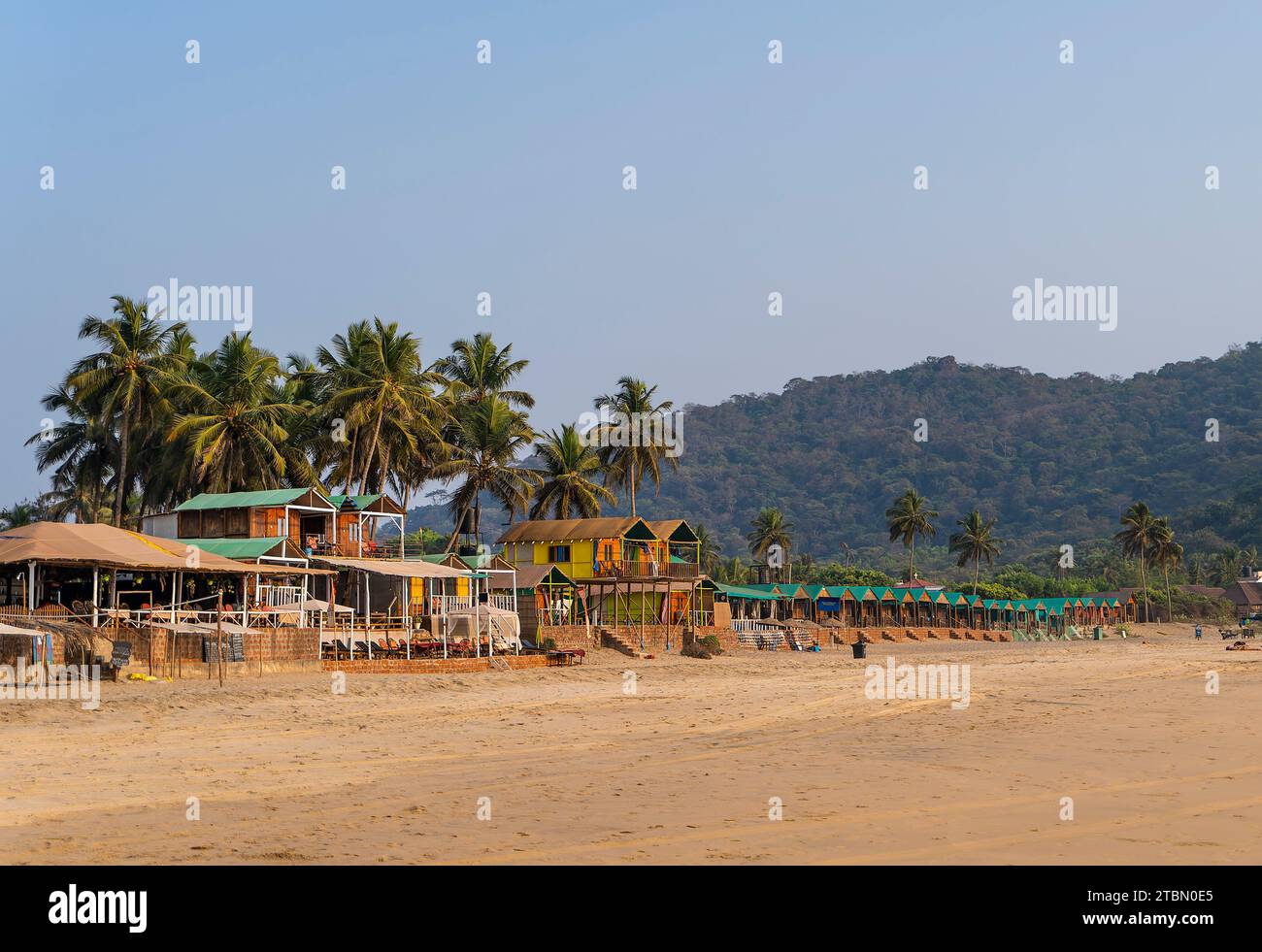 Colorful huts in Agonda beach with palm trees background in Goa, India ...