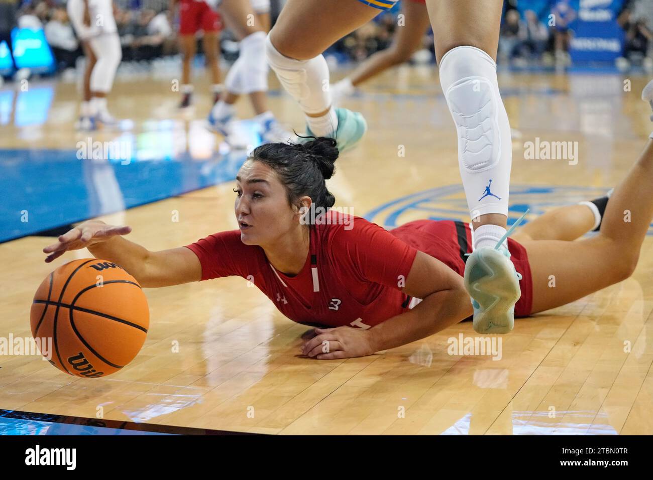Cal State Northridge guard Rachel Harvey, left, reaches for a loose ...