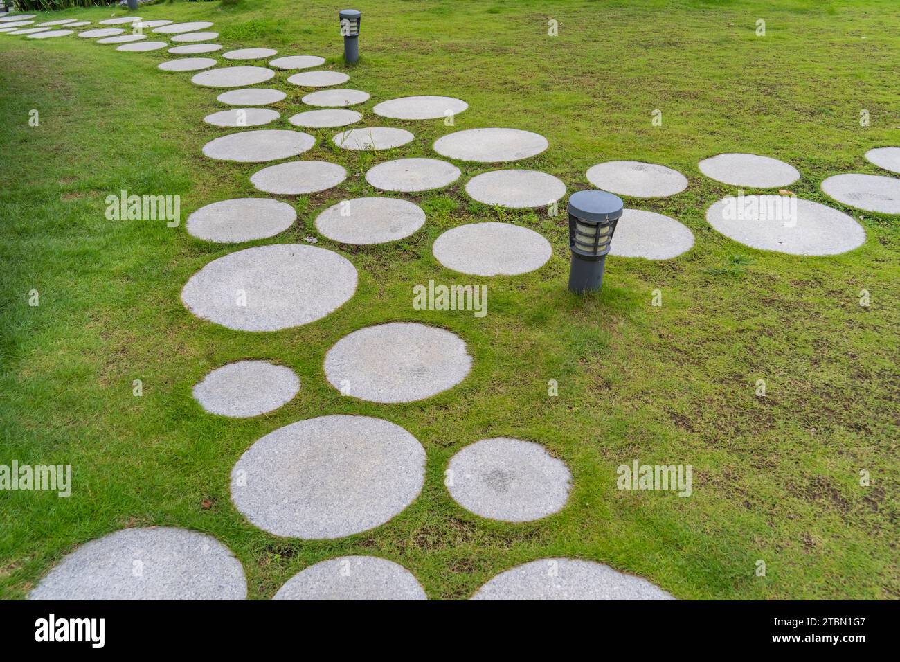Walkway in the park garden made of round rock Stock Photo - Alamy