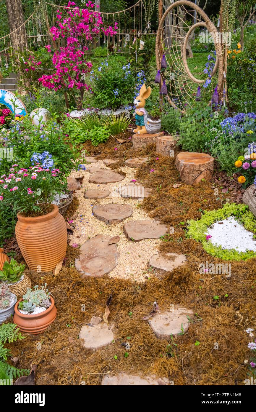 path leading through a garden with rabbit statue decorated Stock Photo ...