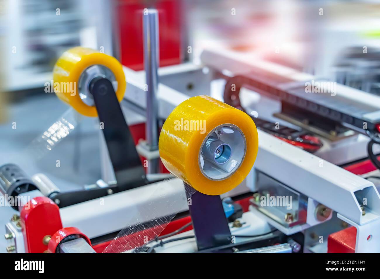 adhesive tape and cardboard in production line for packing product ...