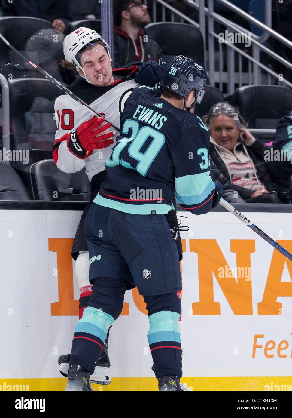 Seattle Kraken defenseman Ryker Evans (39) checks New Jersey Devils ...