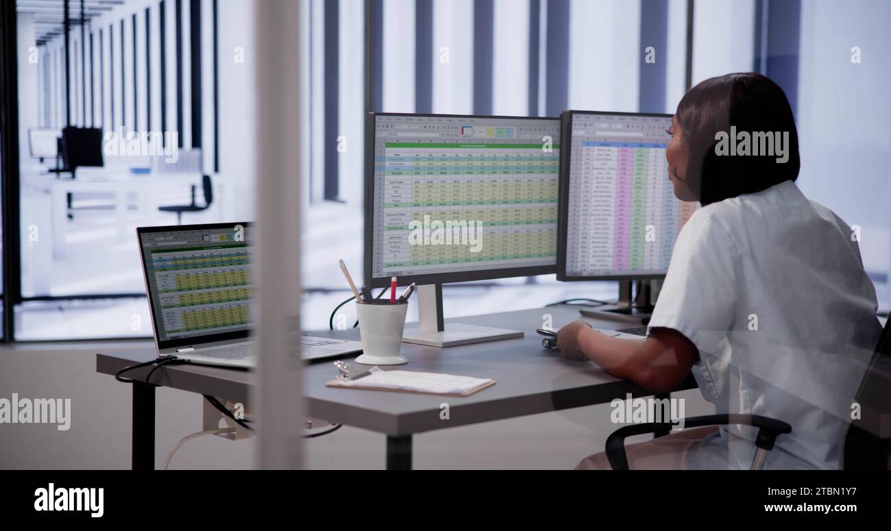Nurse and a Medical Manager Analyzing Hospital Data and Codes for Bill ...