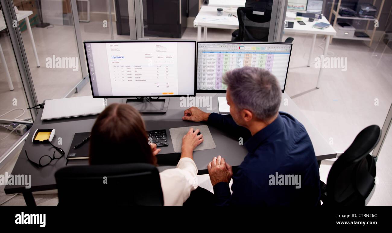 Working Analyst at Desktop PC with Multiple Spreadsheets Stock Photo ...