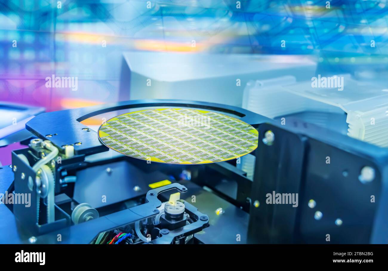 Semiconductor and Computer Chip Manufacturing at Fab or Foundry with robotic arms with silicon ...