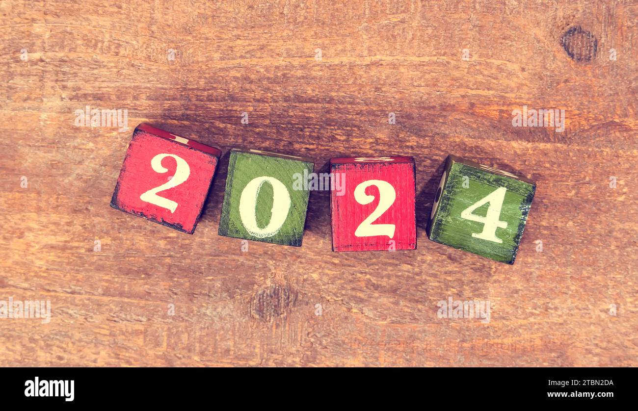 2024 year concept with wooden blocks and text Stock Photo - Alamy