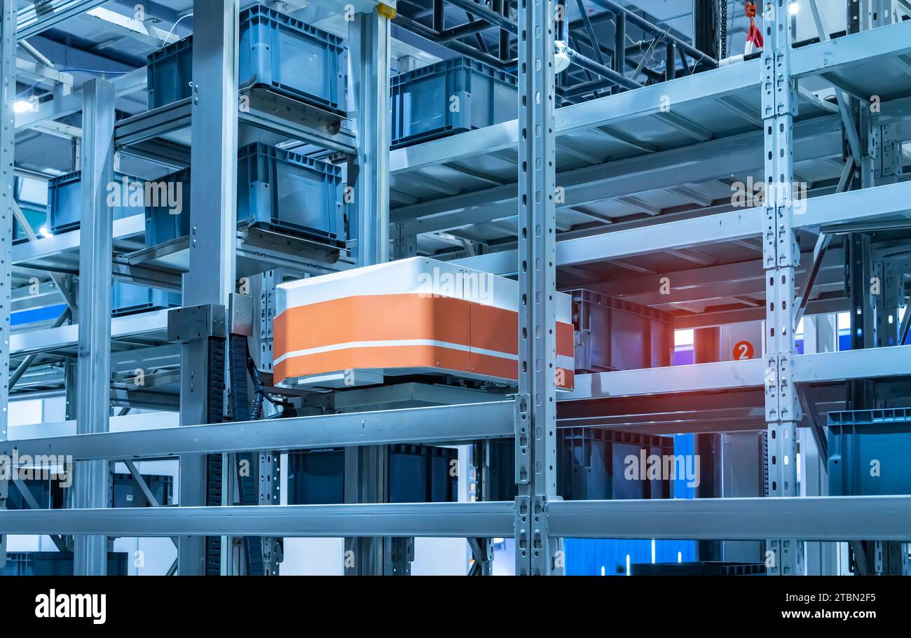 logistic warehouse storage facility with automated guided vehicles forklift lifting carton in ...