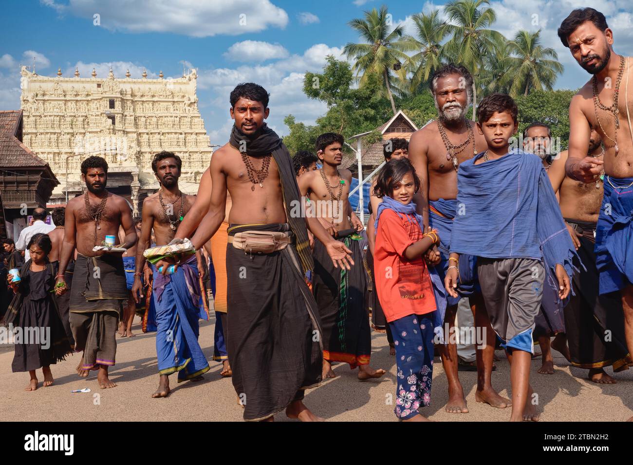 A group of young and old Hindu pilgrims outside Padmanabhaswamy Temple ...