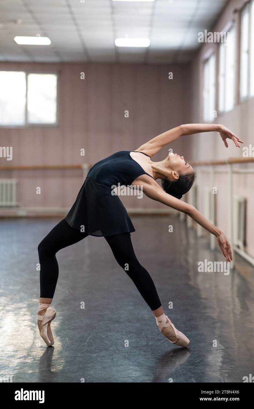Asian woman dancing in ballet class. Bending in the back Stock Photo ...