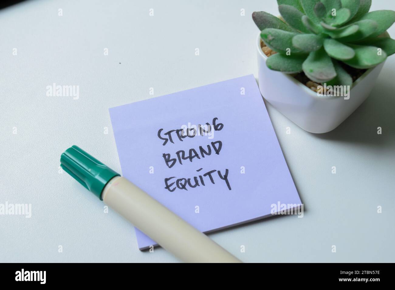 Concept of Strong Brand Equity write on sticky notes isolated on white ...