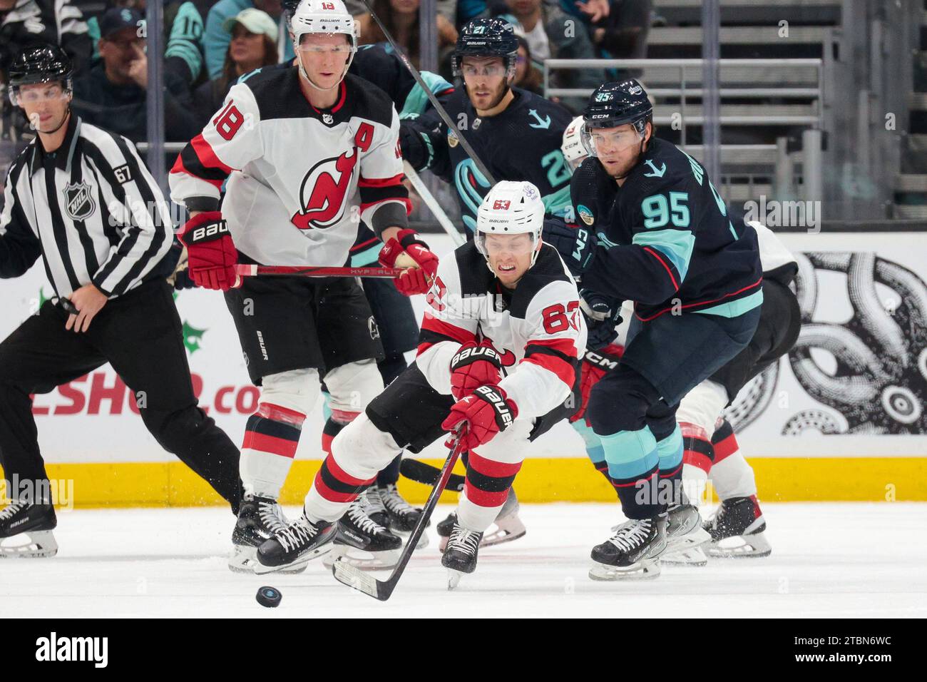 New Jersey Devils left wing Jesper Bratt (63) goes for the puck as ...