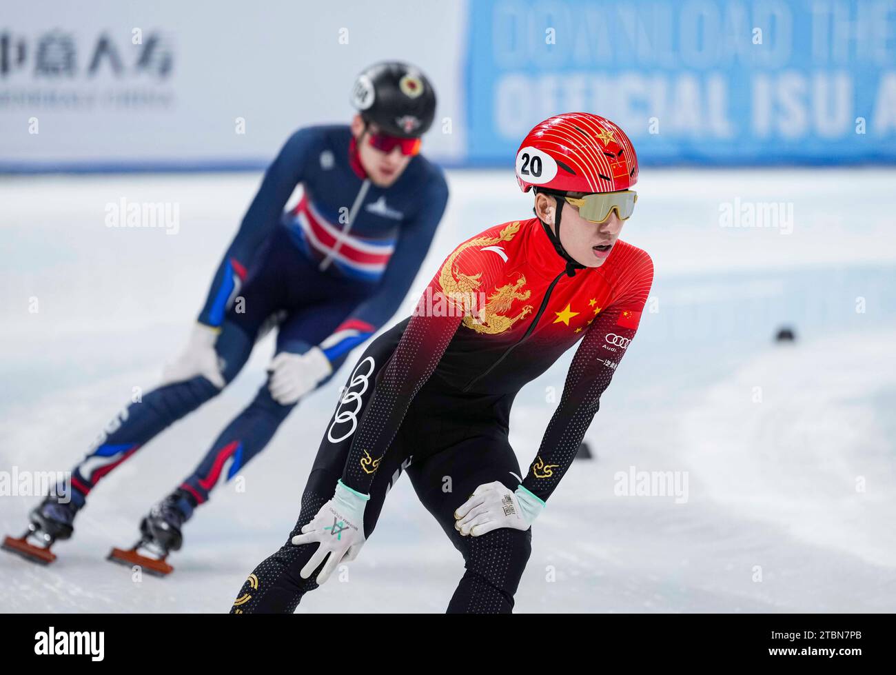 Beijing, China. 8th Dec, 2023. Lin Xiaojun (R) of China reacts after the preliminaries of men's ...