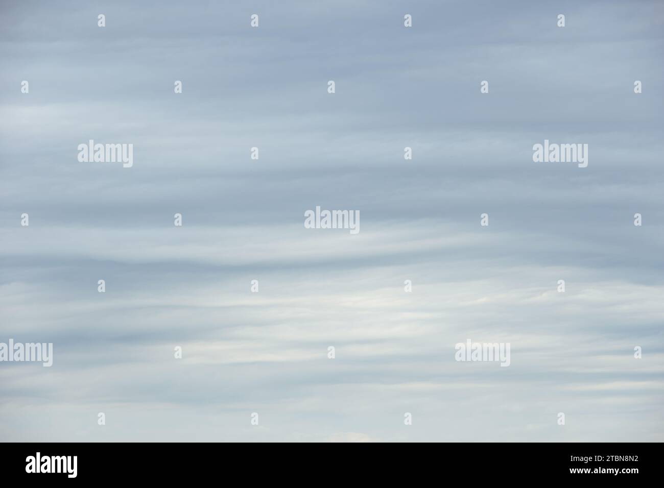 Dense gray thunderstorm cumulus wavy clouds in the whole frame. Gloomy ...