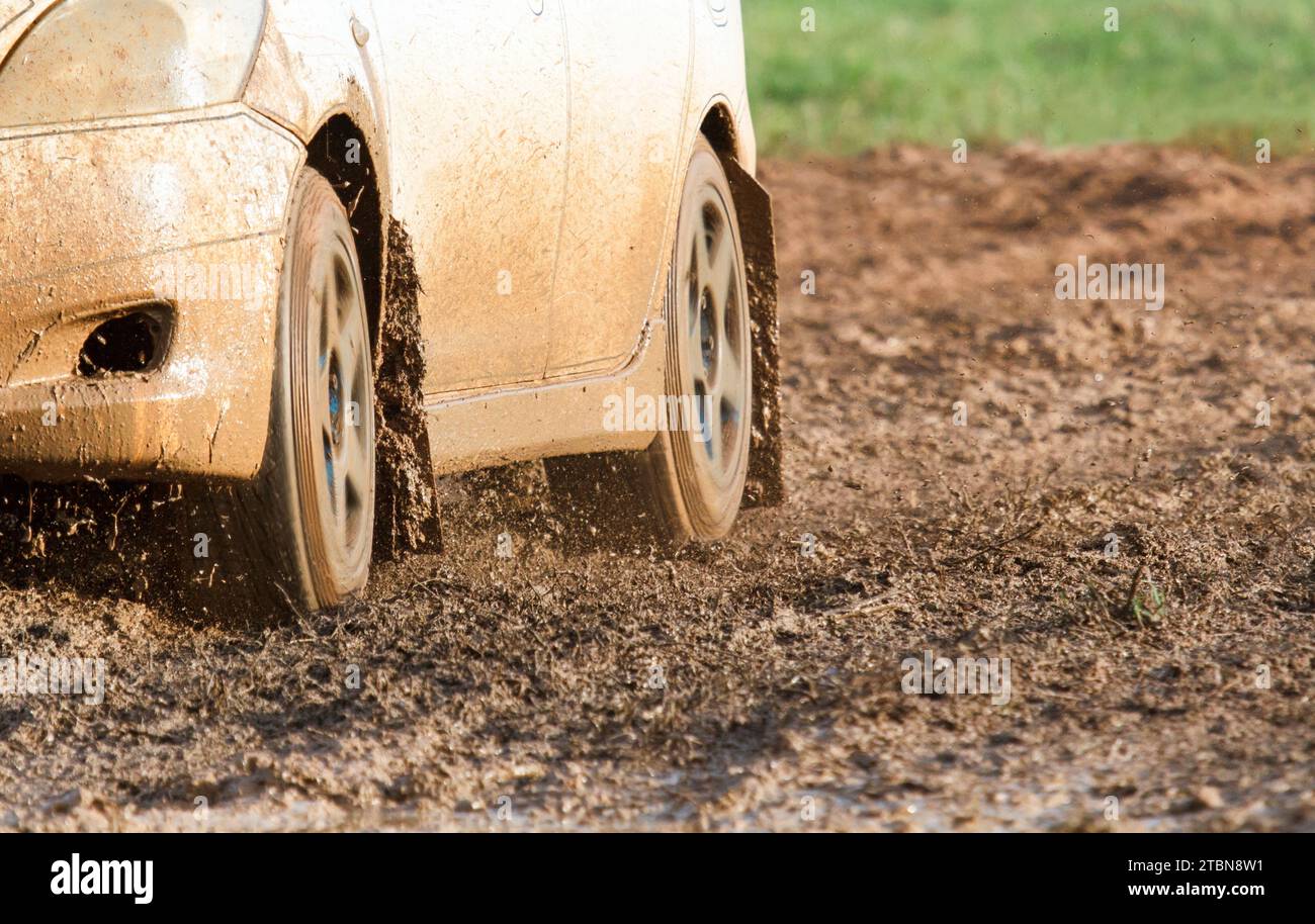 car on muddy road Stock Photo - Alamy
