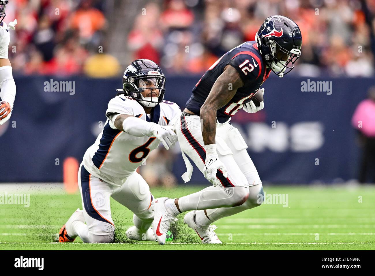 Houston Texans wide receiver Nico Collins (12) catches a pass as Denver ...