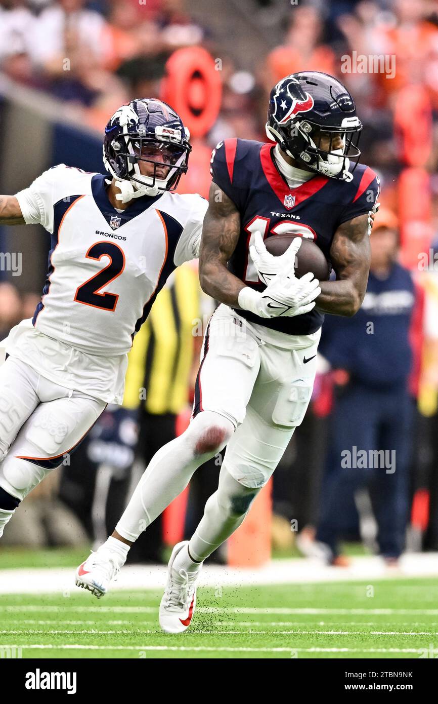 Houston Texans wide receiver Nico Collins (12) catches a pass as Denver ...