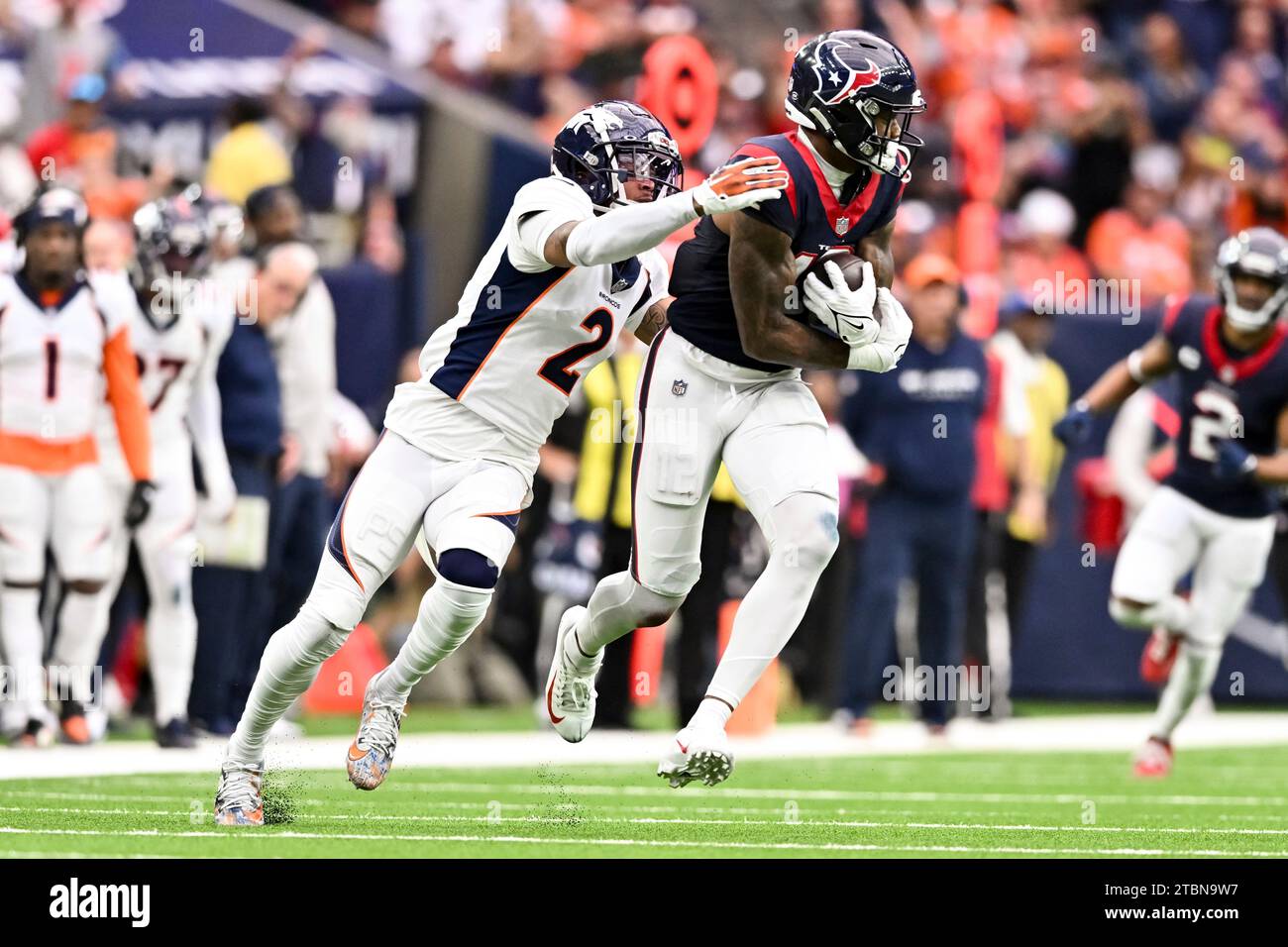 Houston Texans wide receiver Nico Collins (12) catches a pass as Denver ...
