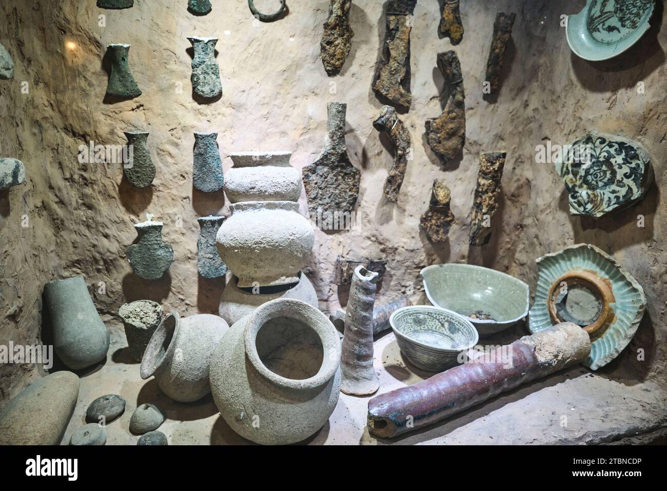 A display of ancient, old artifacts, vases, tools used in work. At the ...