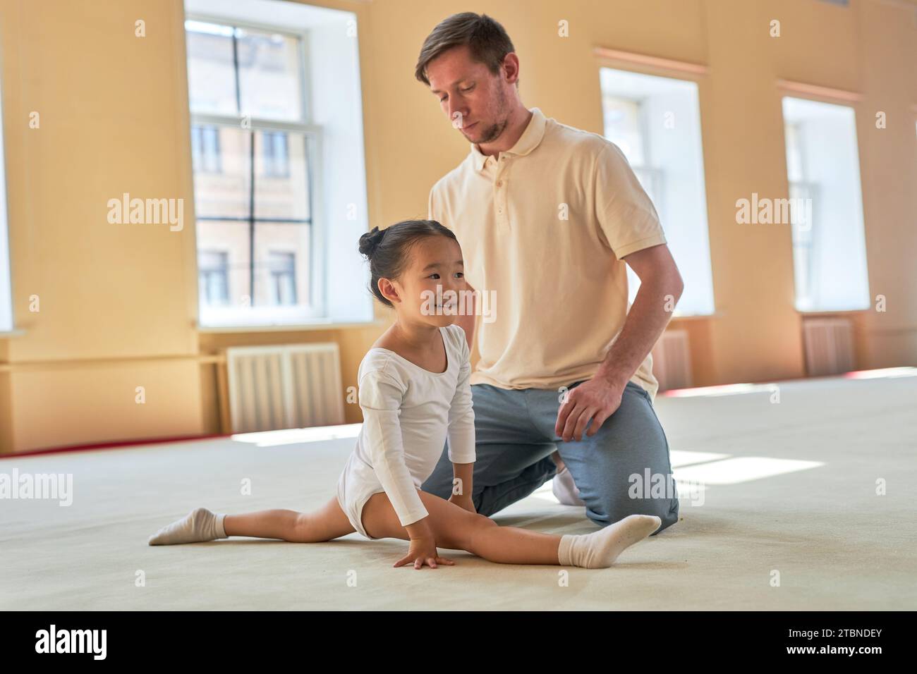 Happy Little Gymnast Having Success in Performing Split Stock Photo - Alamy