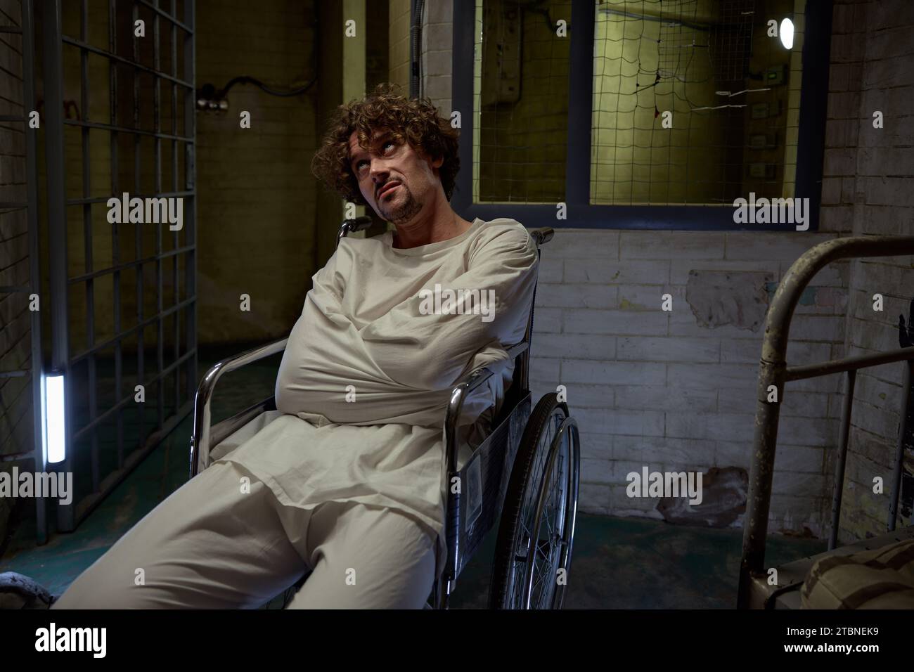 Mentally ill patient wearing straitjacket sitting in wheelchair Stock ...