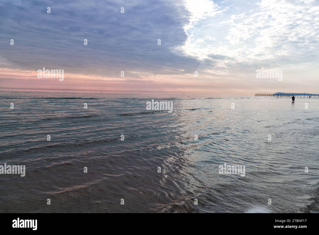Beautiful sunset on the beach in Rimini Stock Photo - Alamy
