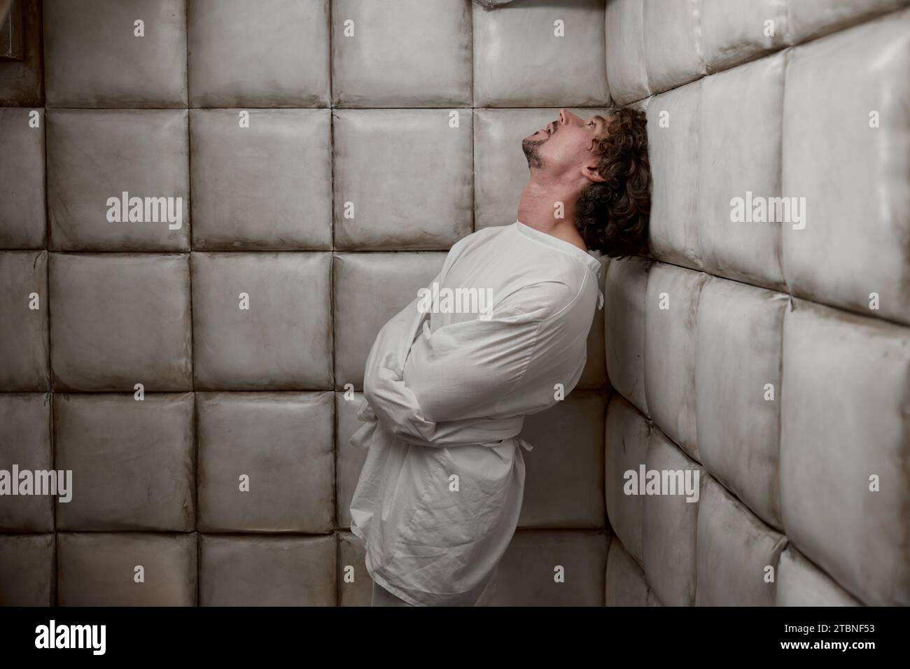 Calm man with schizophrenia mental disorder in white padded room Stock ...