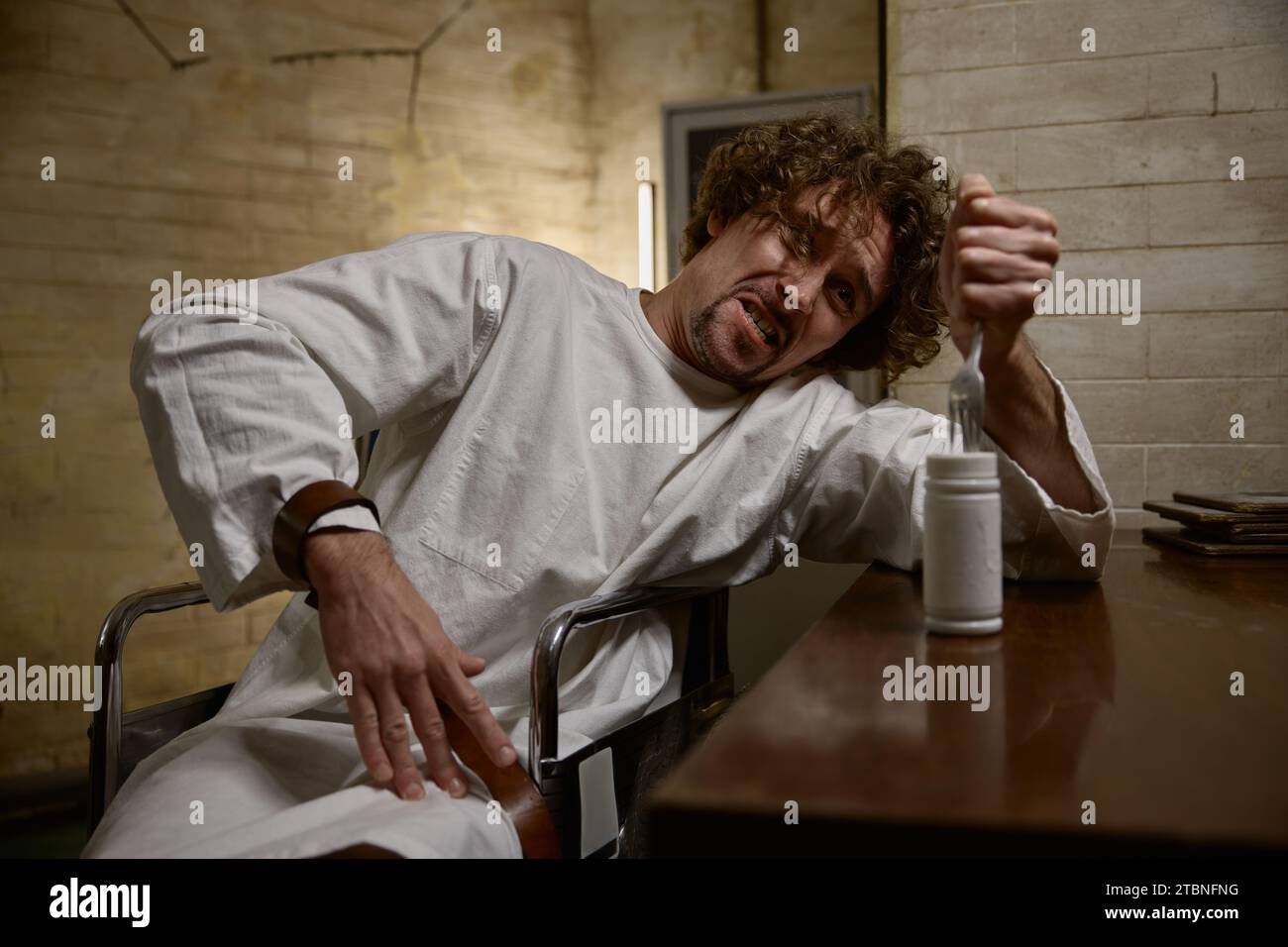 Psycho man in wheelchair feeling madness and schizophrenia attack Stock ...