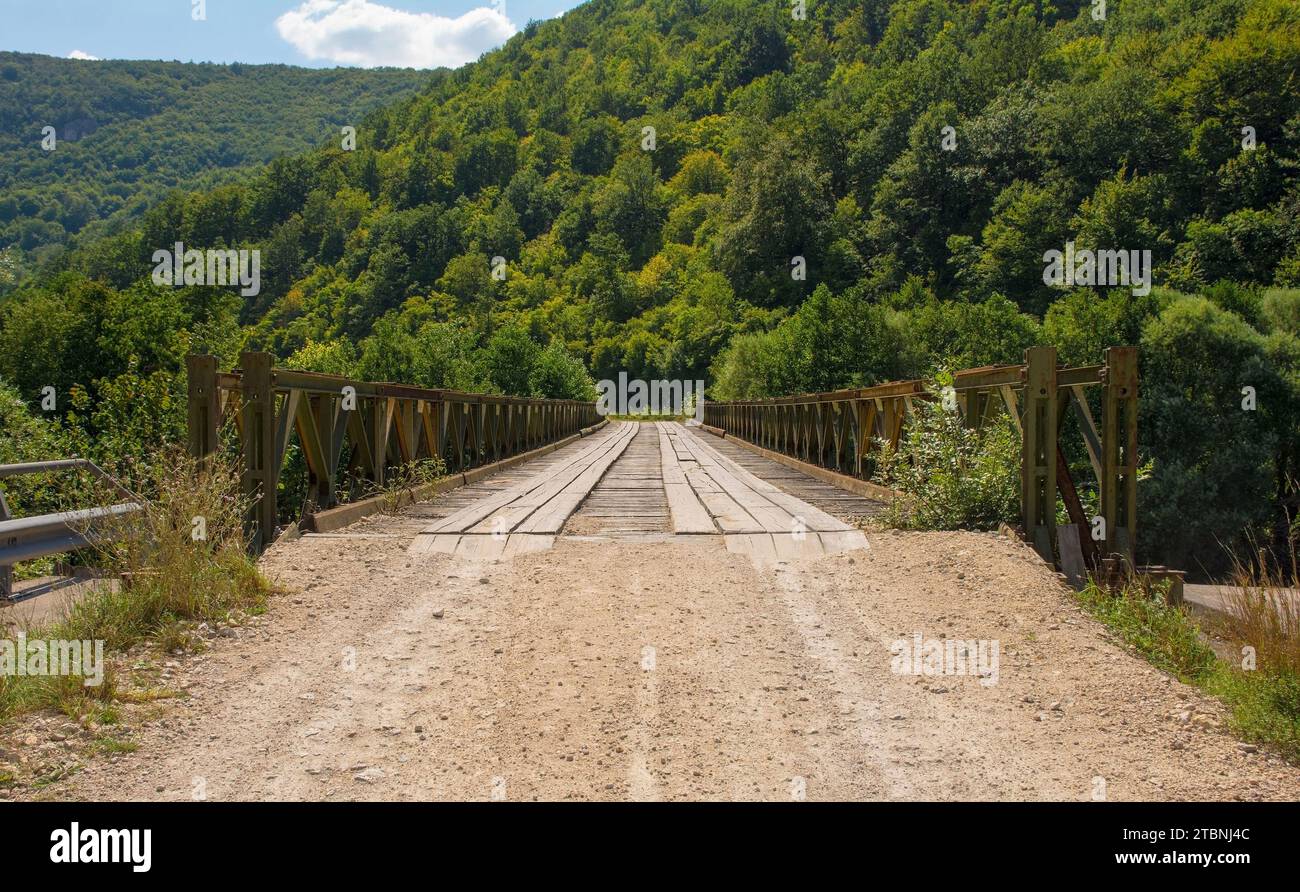 A wooden bridge crossing the River Una in Martin Brod in the Una ...