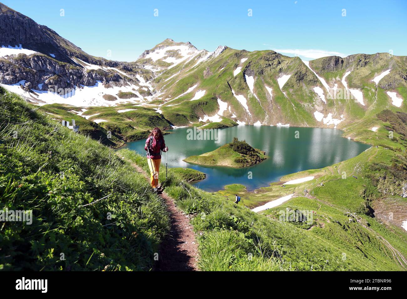Woman hiking at Schrecksee in the Allgäu Alps Stock Photo - Alamy