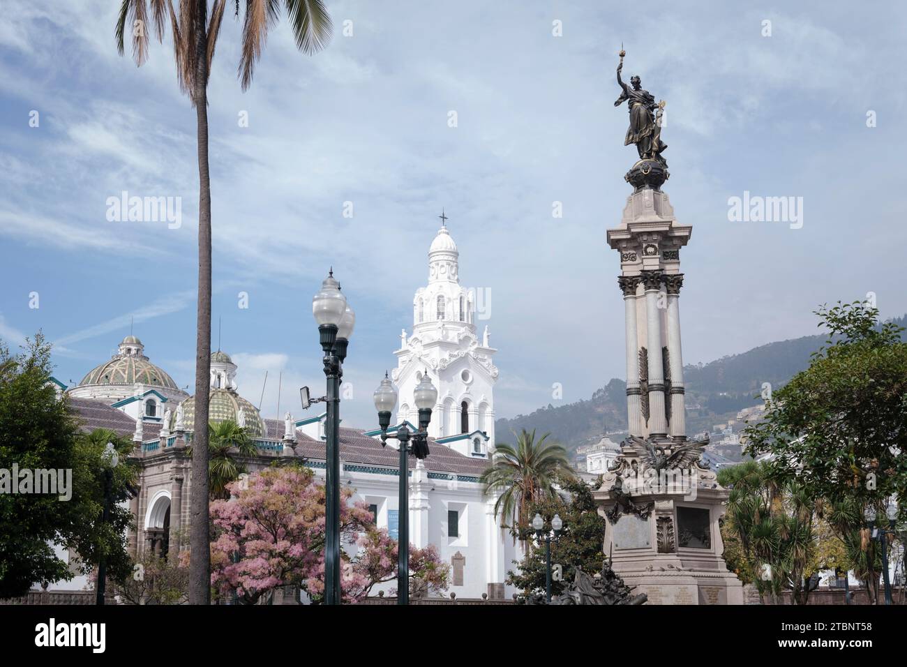 Old monument and white church in main square of Quito Stock Photo - Alamy