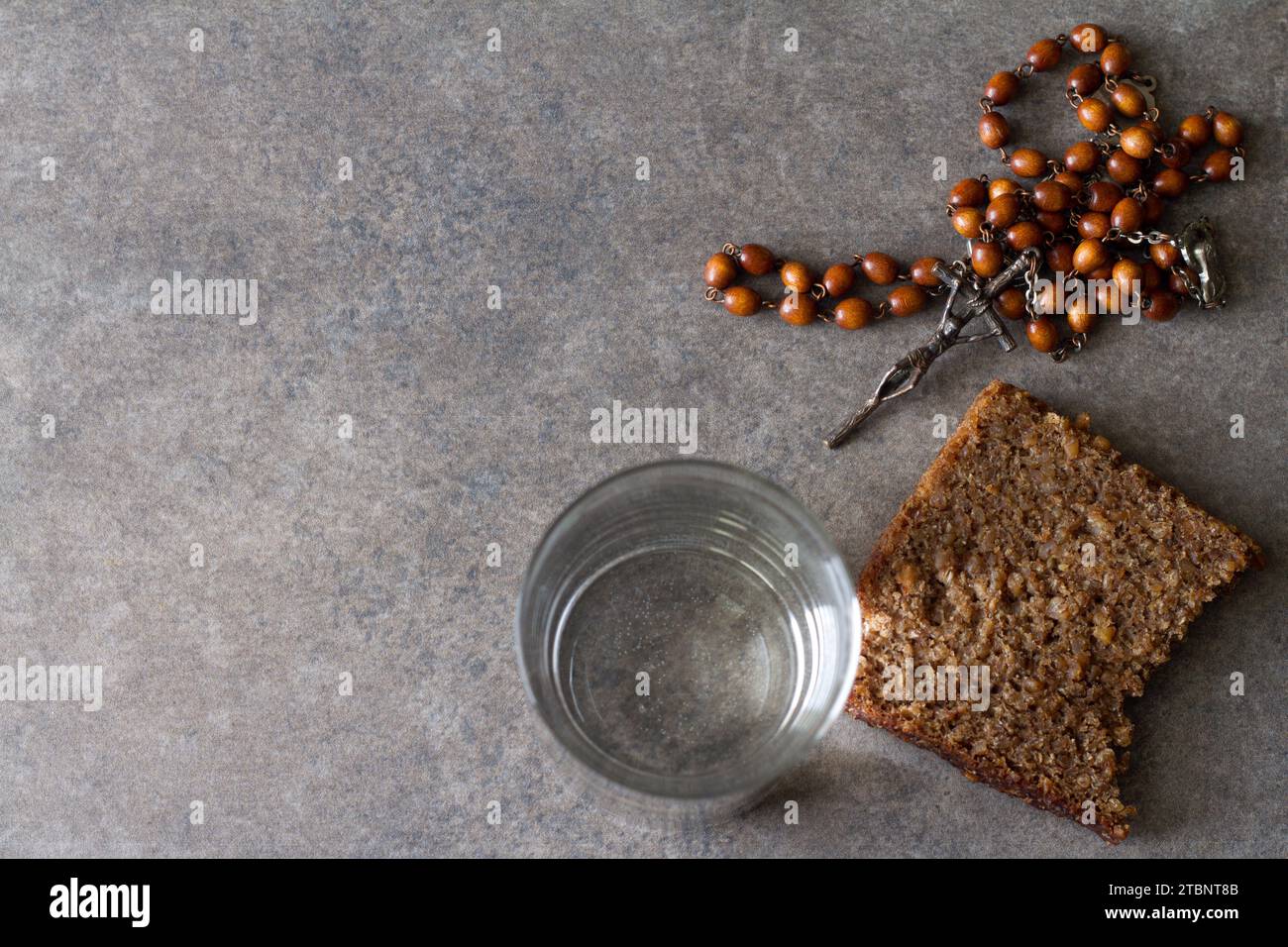 Rosary, water and bread. Lent Season, Holy Week, Good Friday. Religious ...