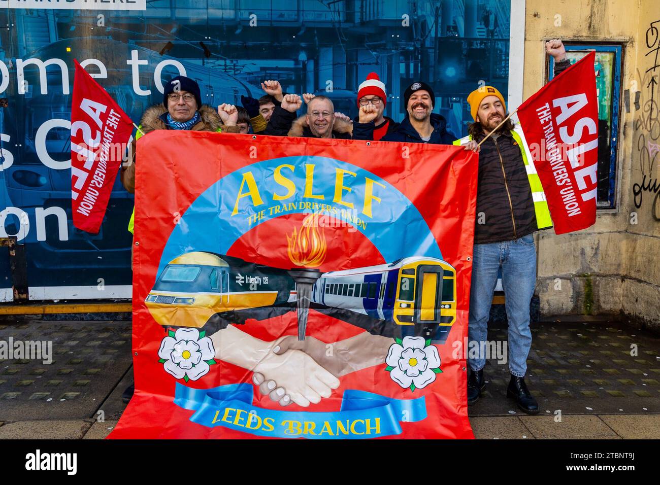 Leeds, UK, 08 Dec 2023, ASLEF picket line at Leeds Station. Members of ASLEF Leeds Branch stand ...
