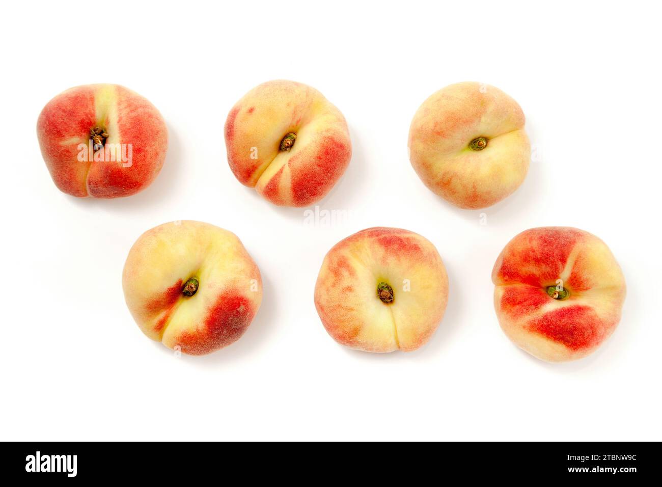 Several ripe chinese flat peach fruits or saturn peaches with soft ...
