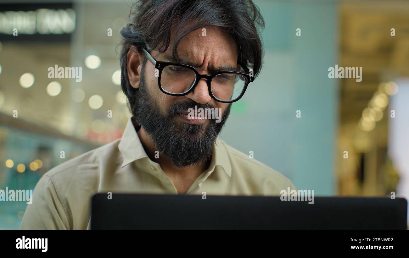 Stressed upset Indian Muslim bearded man in glasses talk video call has ...