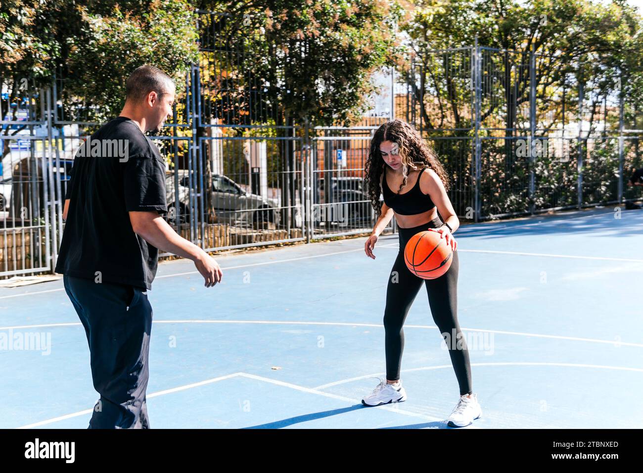 Young adult female on basketball hi-res stock photography and images ...