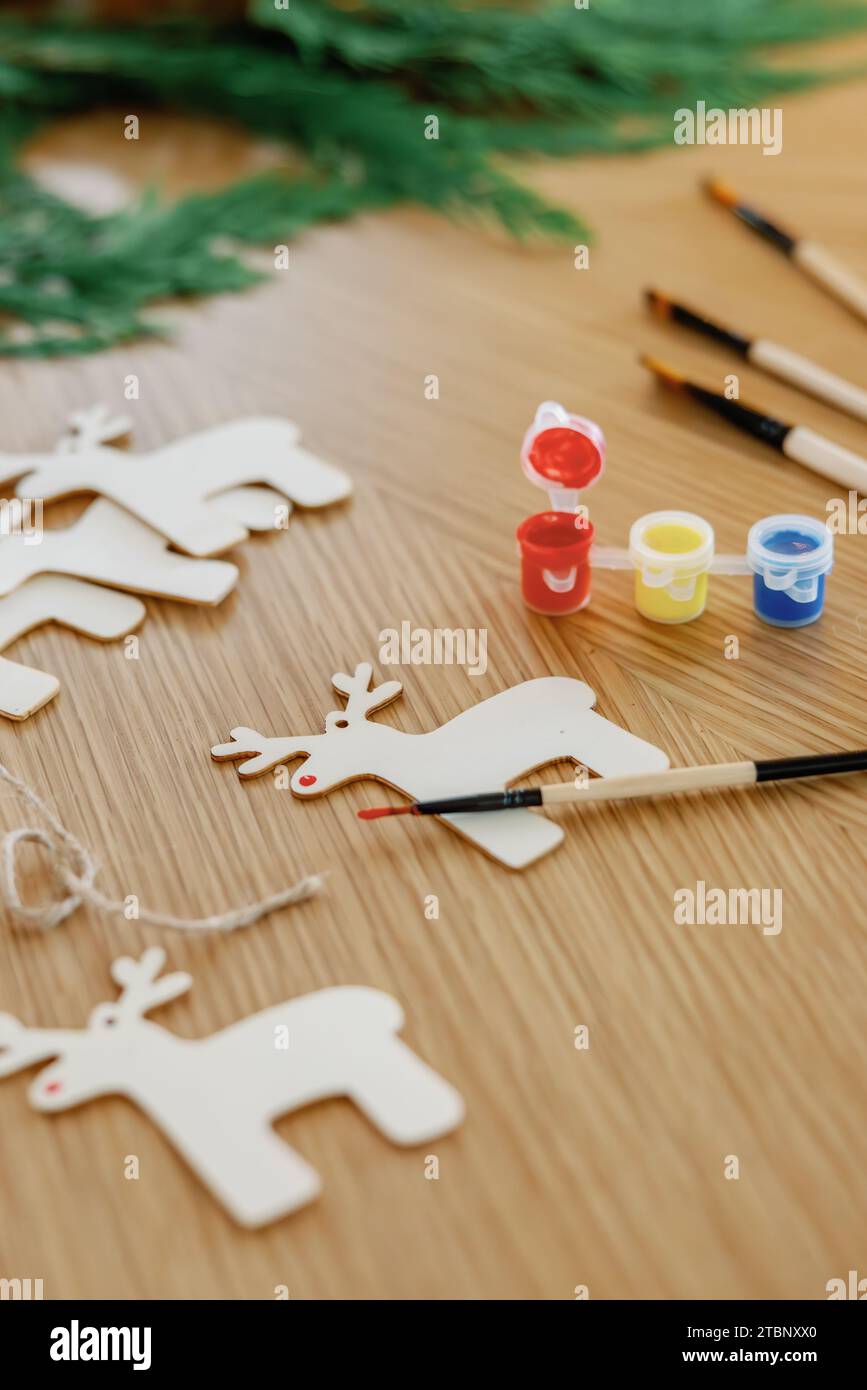 Handmade Rudolph decor in artistic close-up of festive craft table ...
