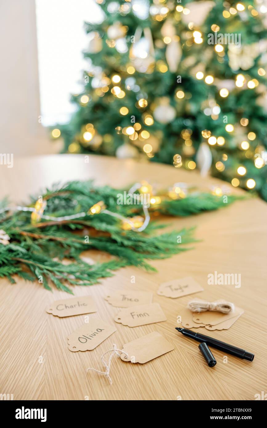 Festive handwritten gift tags with twinkling tree in background Stock ...