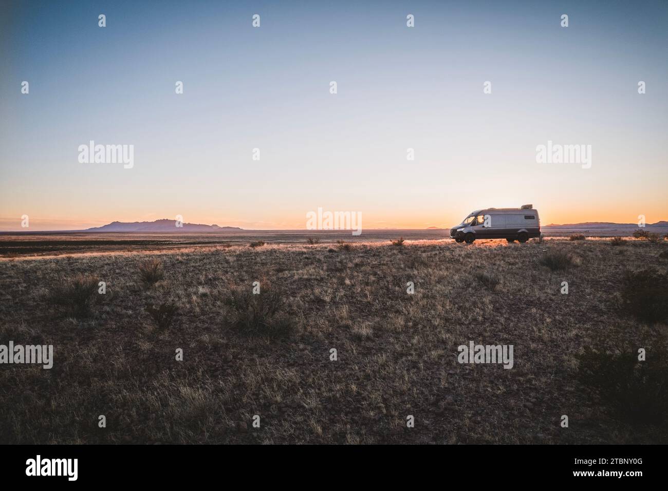 Camper Van RV parked in beautiful desert at sunset Stock Photo - Alamy