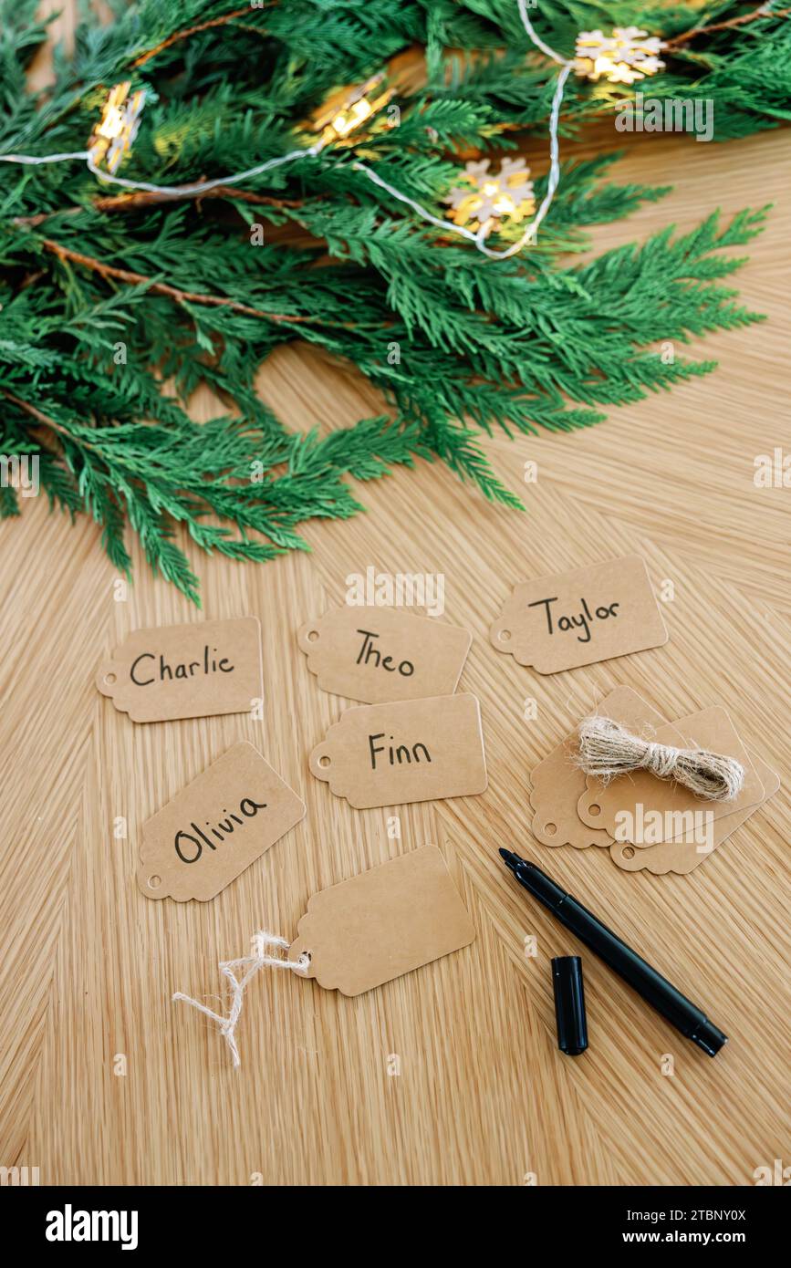 Festive handwritten gift tags with blank space for name Stock Photo - Alamy