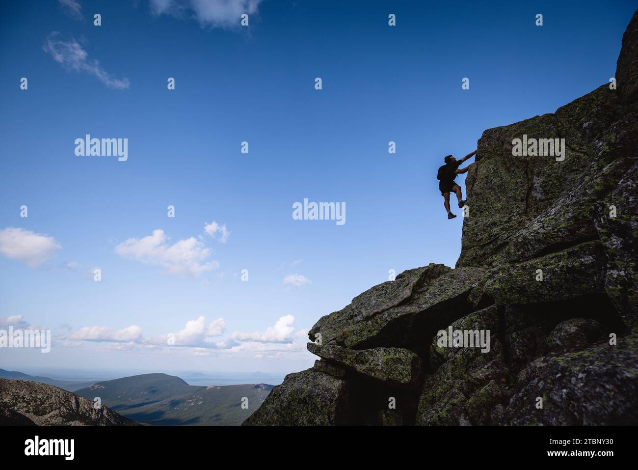 Man clings to edge of exposed cliff on Mount Katahdin, maine Stock ...