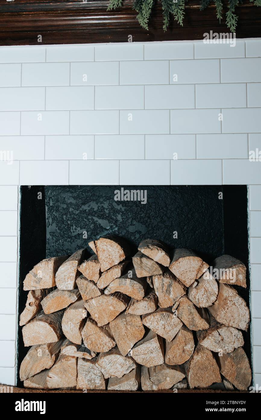 Stacked wood in fireplace, cozy decor Stock Photo - Alamy