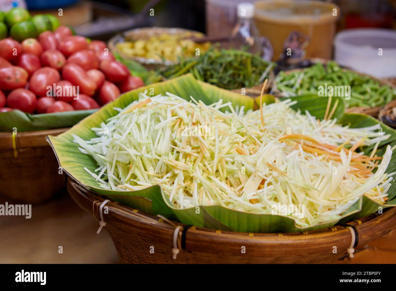 Sliced papaya and ingredients for making Som Tam at street market Stock ...