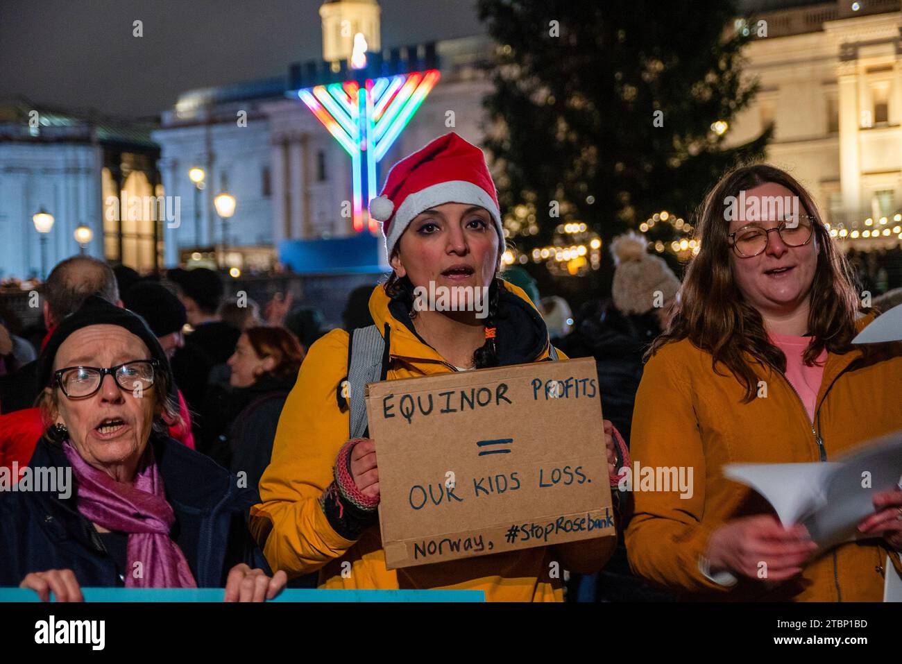 London, UK. 07th Dec, 2023. A protester sings Christmas carols while ...