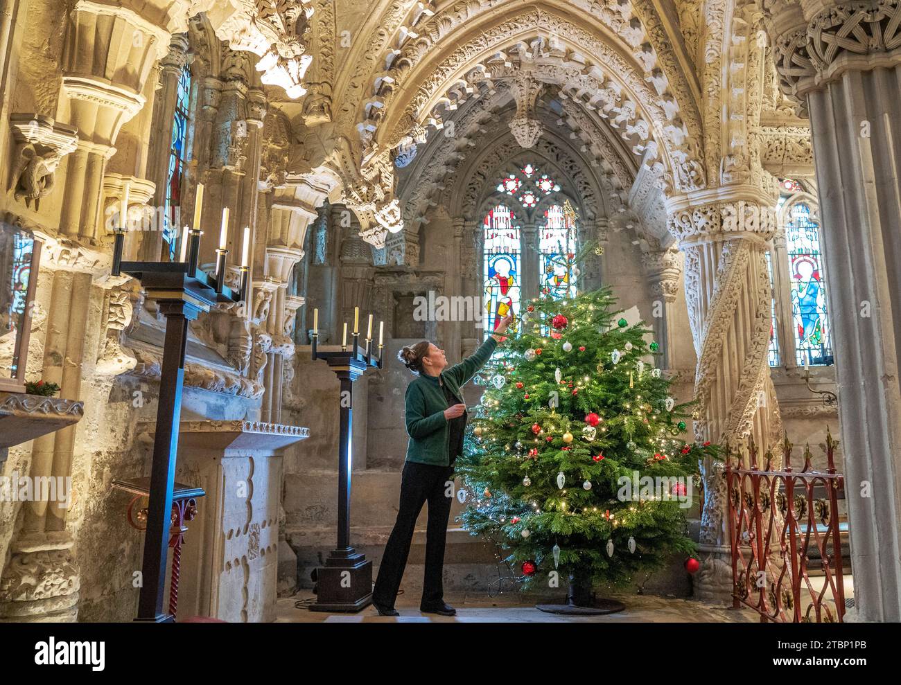 Lorraine Costello puts the finishing touches to the Christmas tree in ...