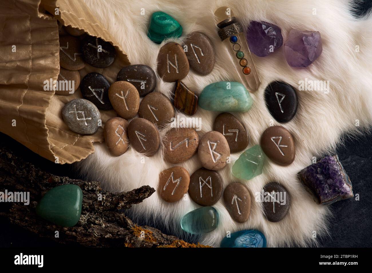 handmade stone runes on white fur Stock Photo - Alamy
