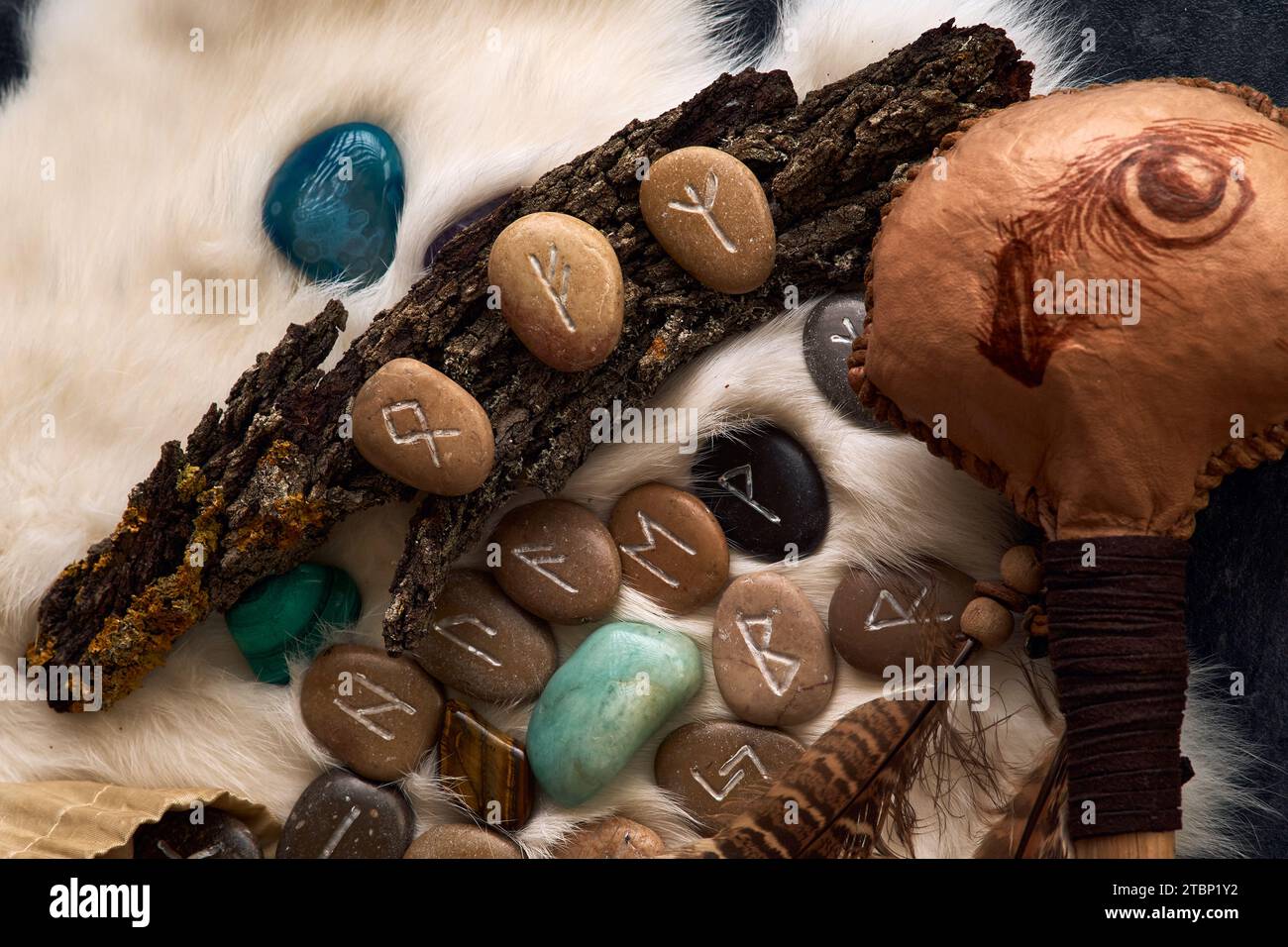 handmade stone runes on white fur Stock Photo - Alamy