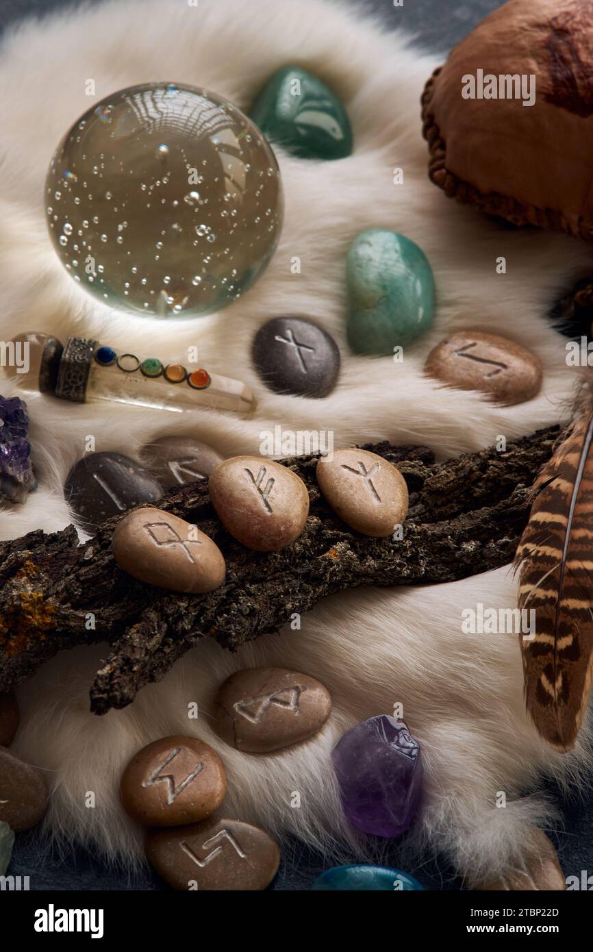 handmade stone runes on white fur Stock Photo - Alamy